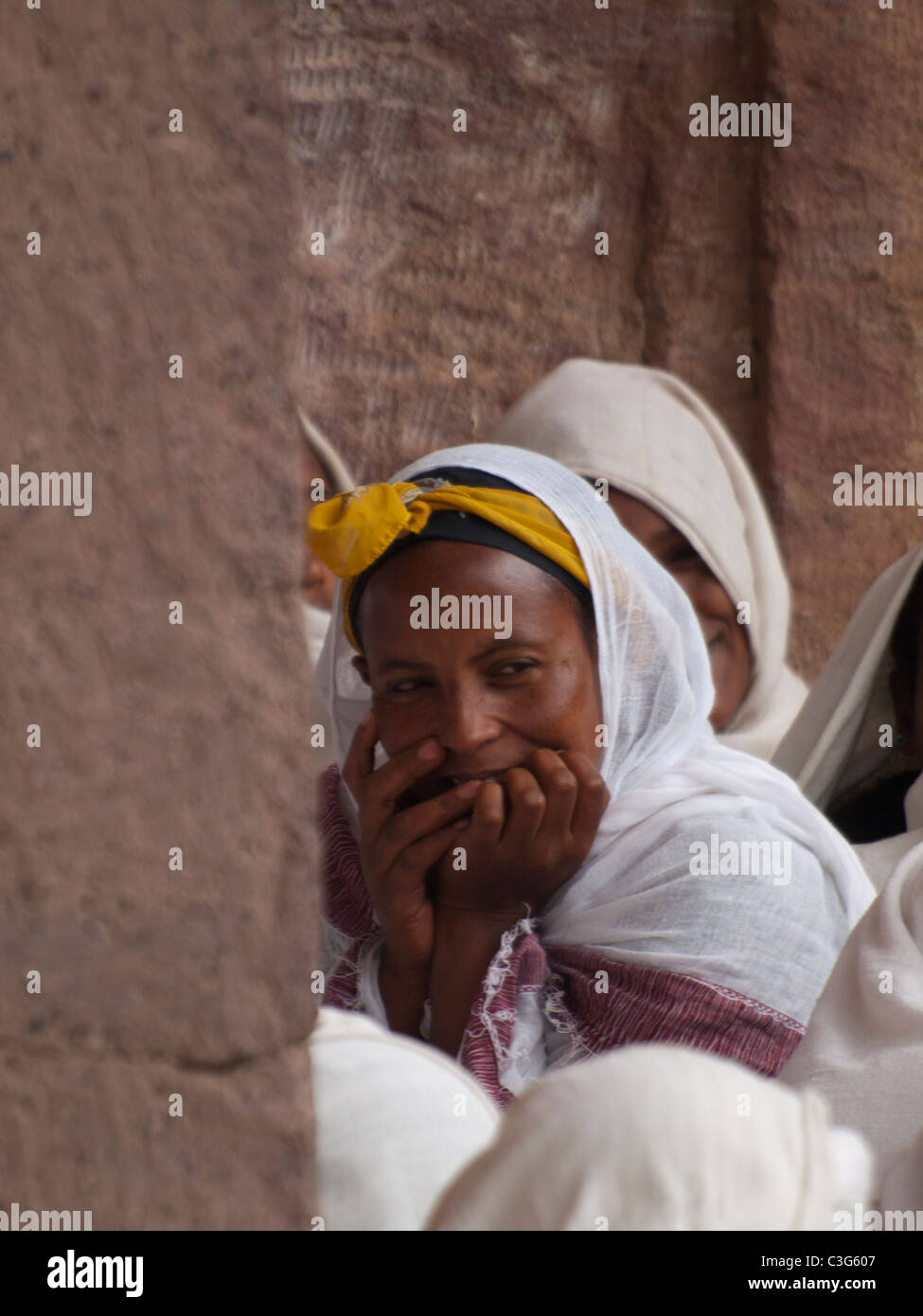 Pilgrims sitting outside church praying in Lalibela during Easter Stock ...