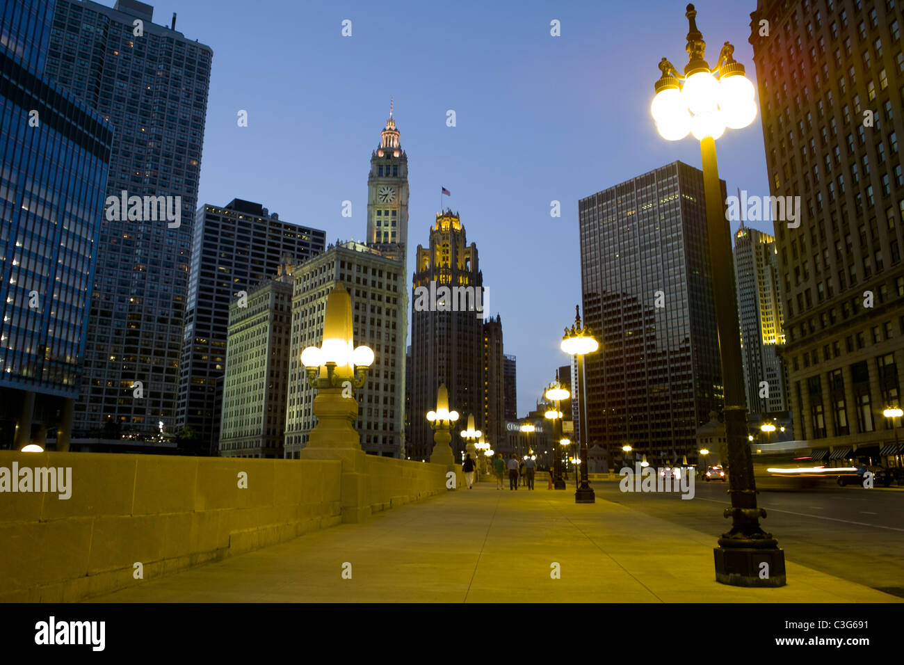 View of skyscrapers down the Chicago River walkway in Chicago, Illinois ...