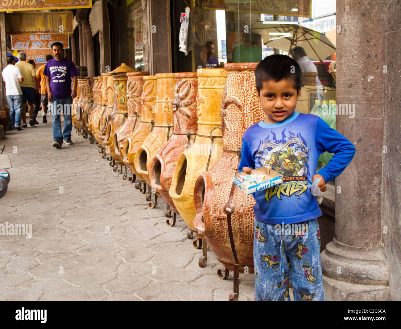 Boy selling inexpensive gum on sidewalk in Nuevo Progreso, Tamaulipas ...