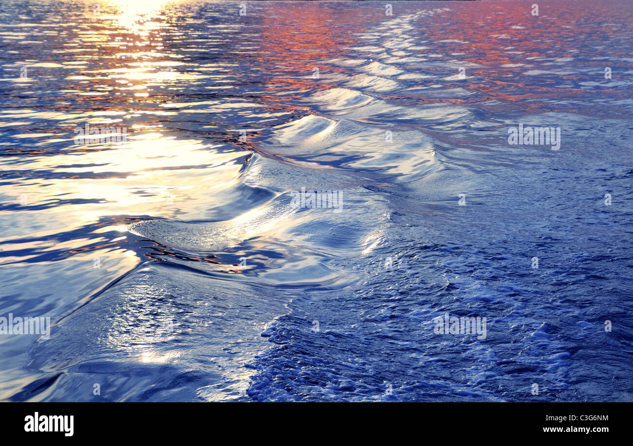 blue sea water waves sunset from boat stern ship wake Stock Photo - Alamy