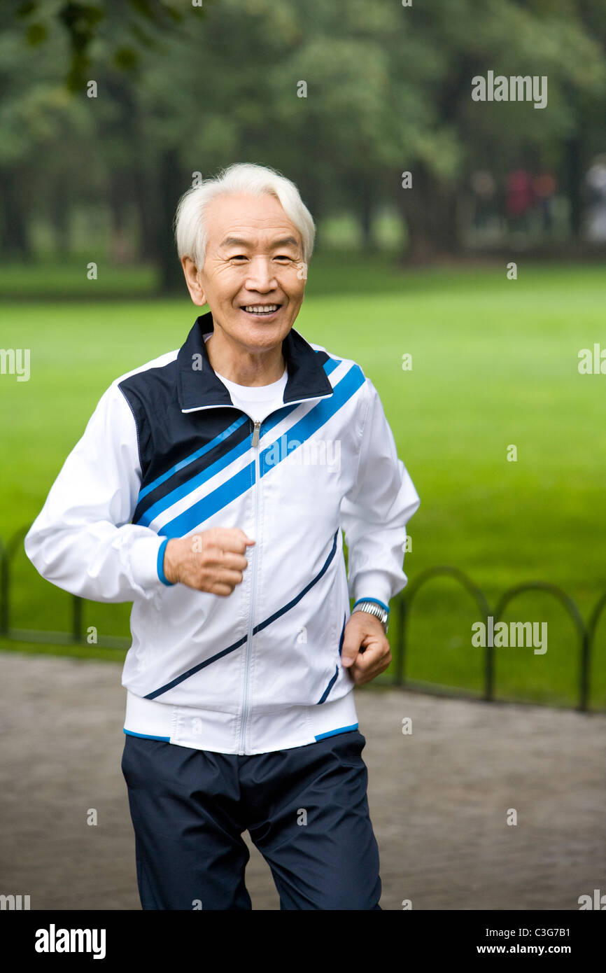 Senior Man Jogging in a Park Stock Photo - Alamy