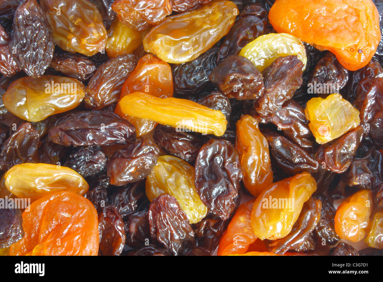Black Jumbo raisins(very big raisins) over white background Stock Photo ...
