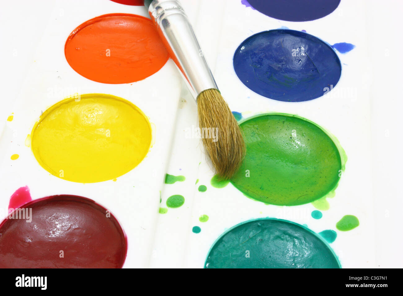 Dirty watercolor paints set with brushes after using Stock Photo - Alamy