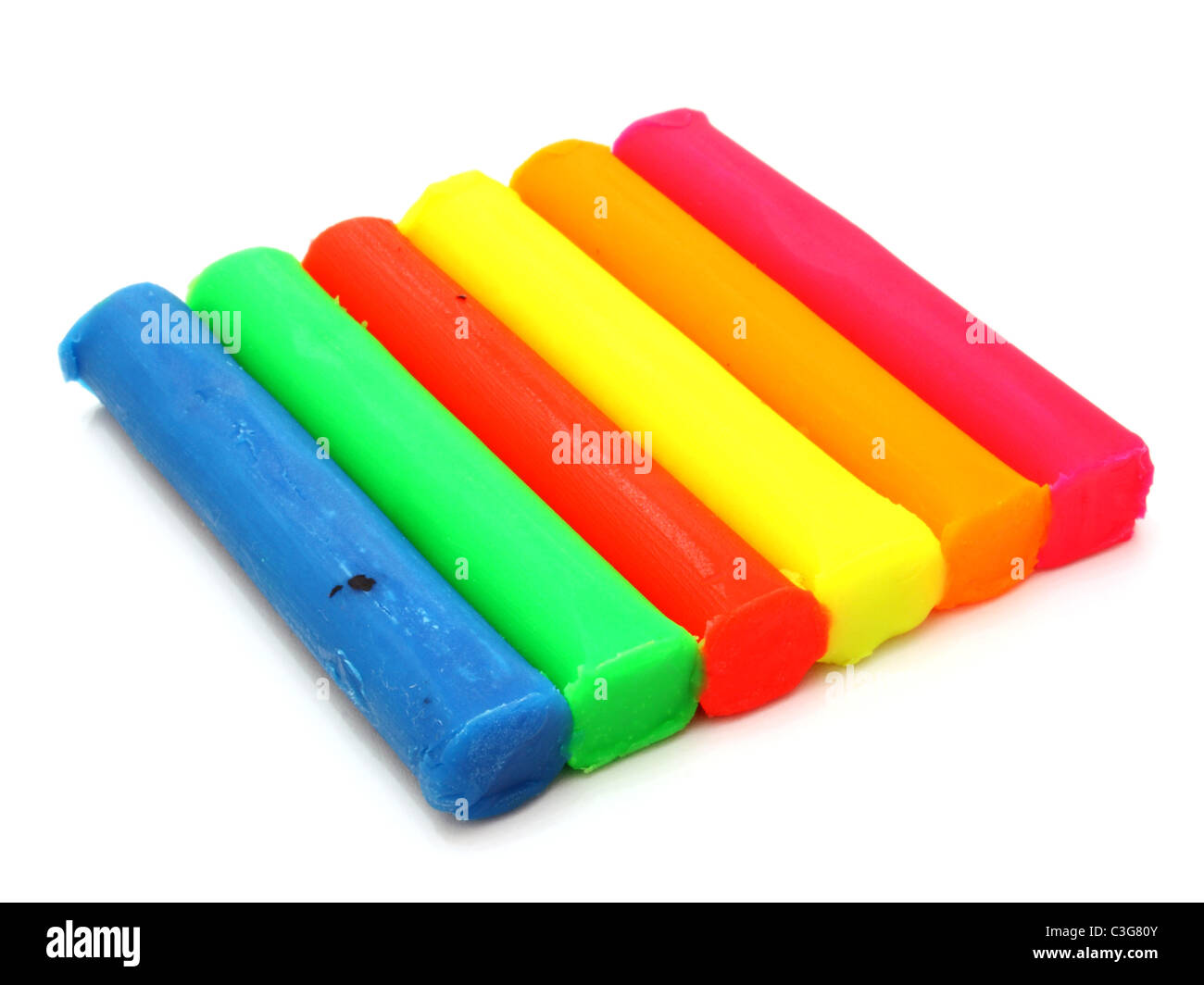 Color children's plasticine lies on a white background Stock Photo - Alamy