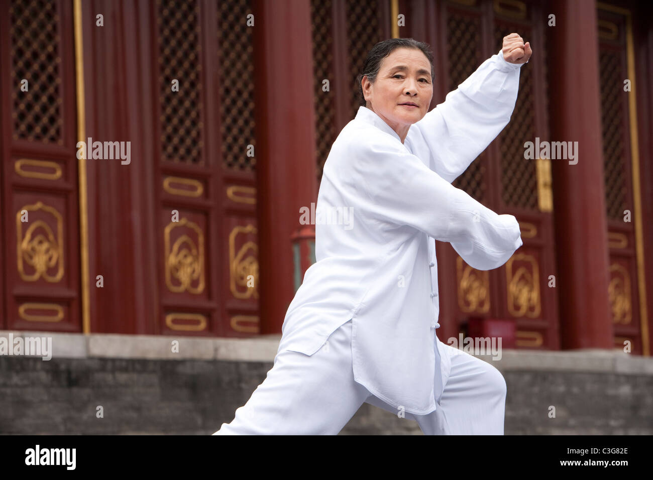 Senior Woman Practicing Tai Chi, Temple of Heaven Stock Photo - Alamy