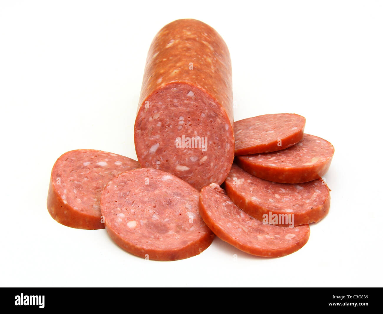 Sausage cut by slices on a white background Stock Photo - Alamy