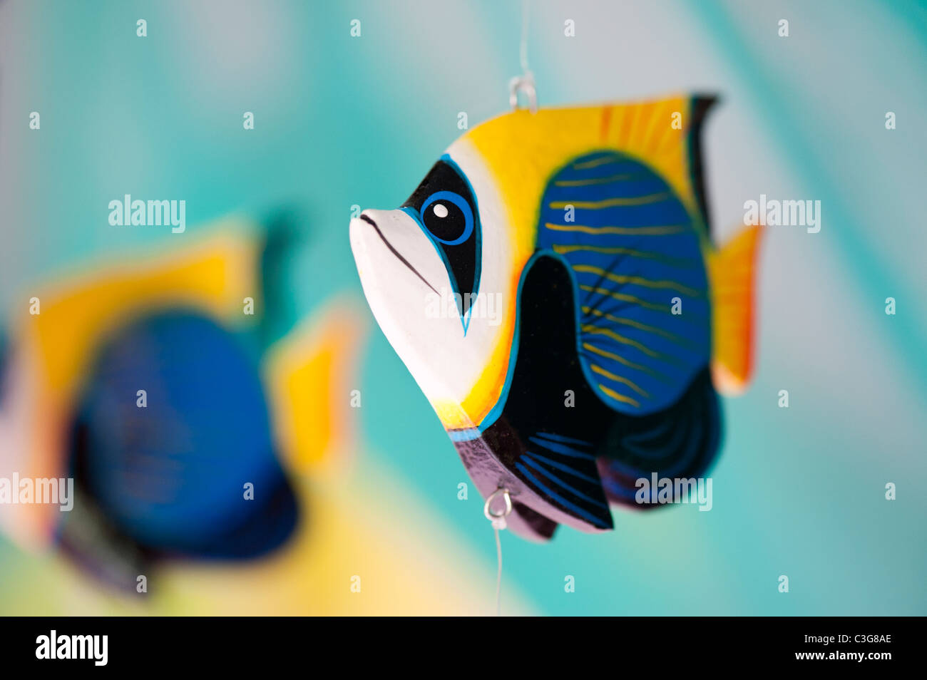 Colourful hanging wooden fish mobile. UK Stock Photo - Alamy