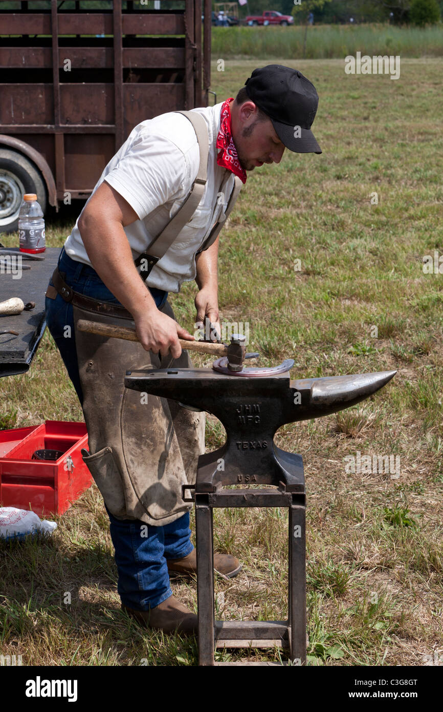 Blacksmith shaping horseshoe for use Stock Photo - Alamy