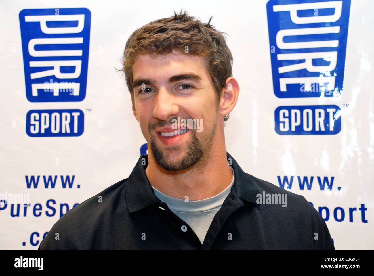 Michael Phelps signs autographs for fans at the GNC store in the Ross ...