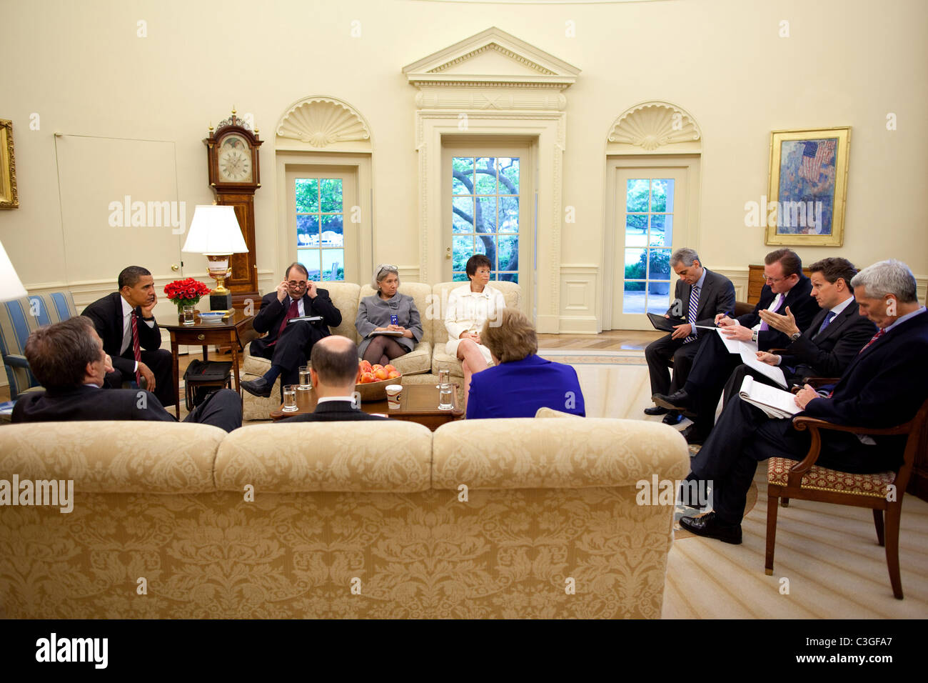 President Barack Obama meets with his staff during the daily economic ...