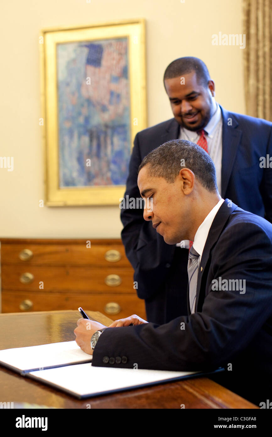 President Barack Obama signs the proclamation marking the National Day ...