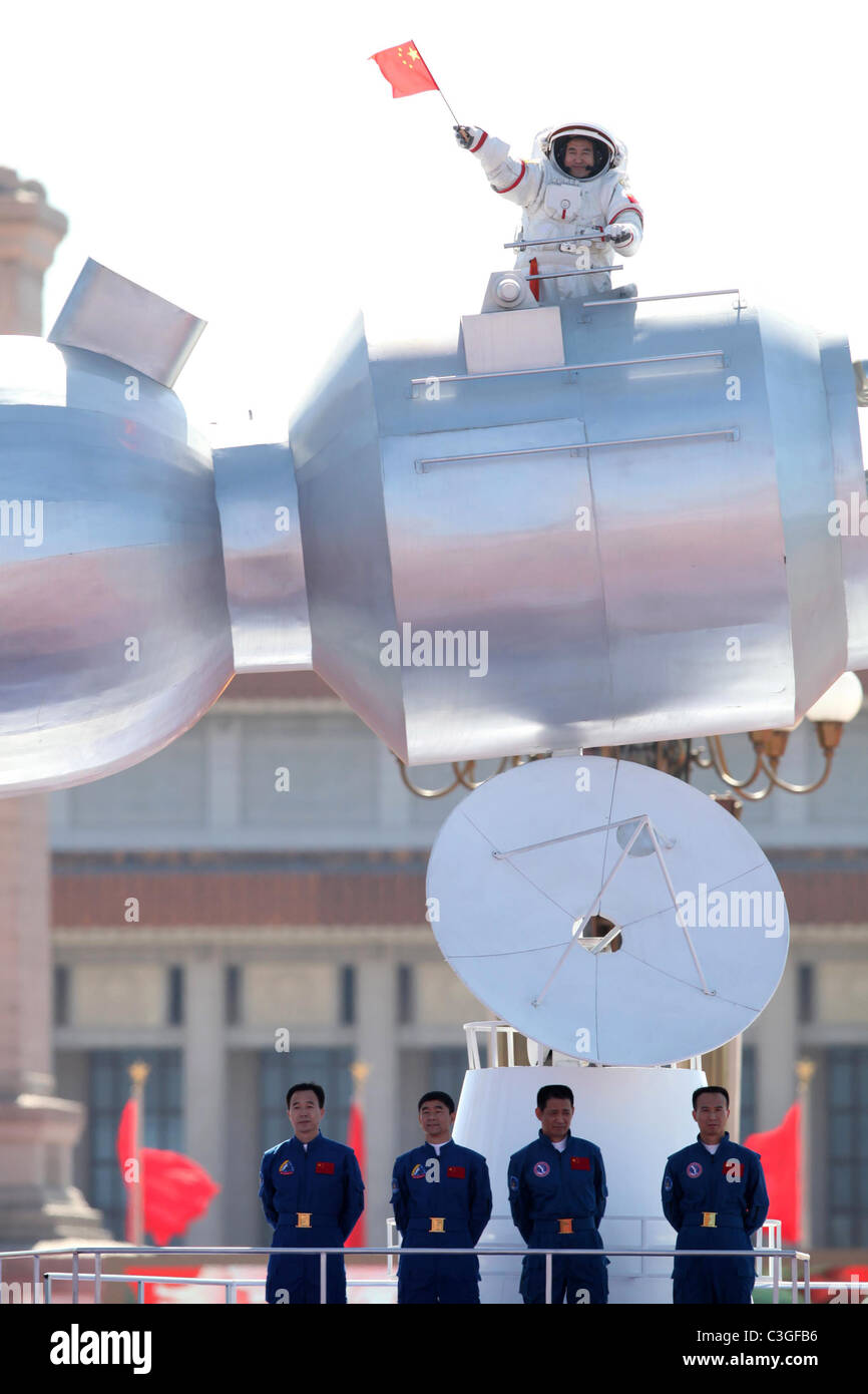 Chinese astronaut Zhai Zhigang waves a national flag in a spacecraft ...