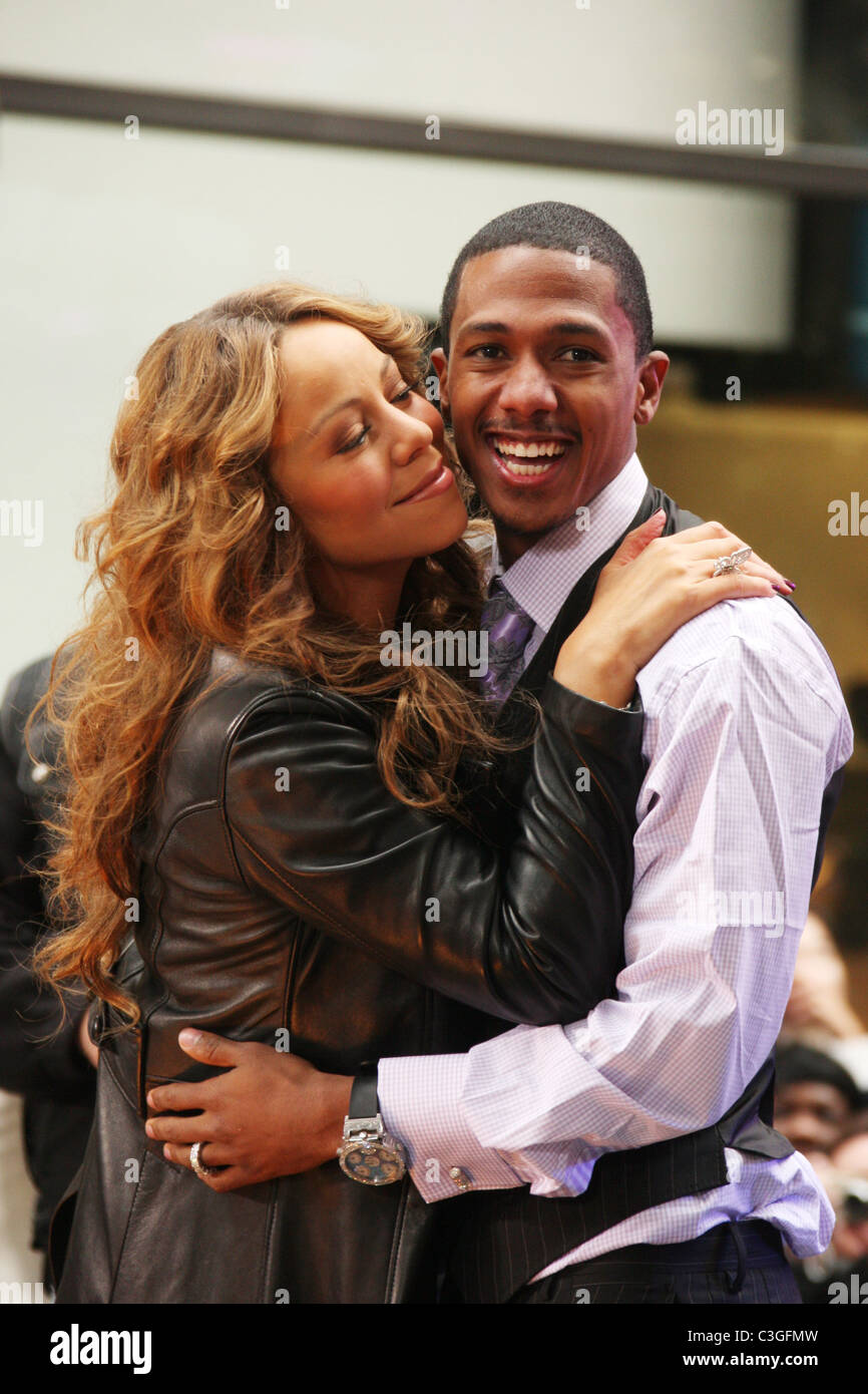 Mariah Carey and Nick Cannon hug each other during her appearance on ...