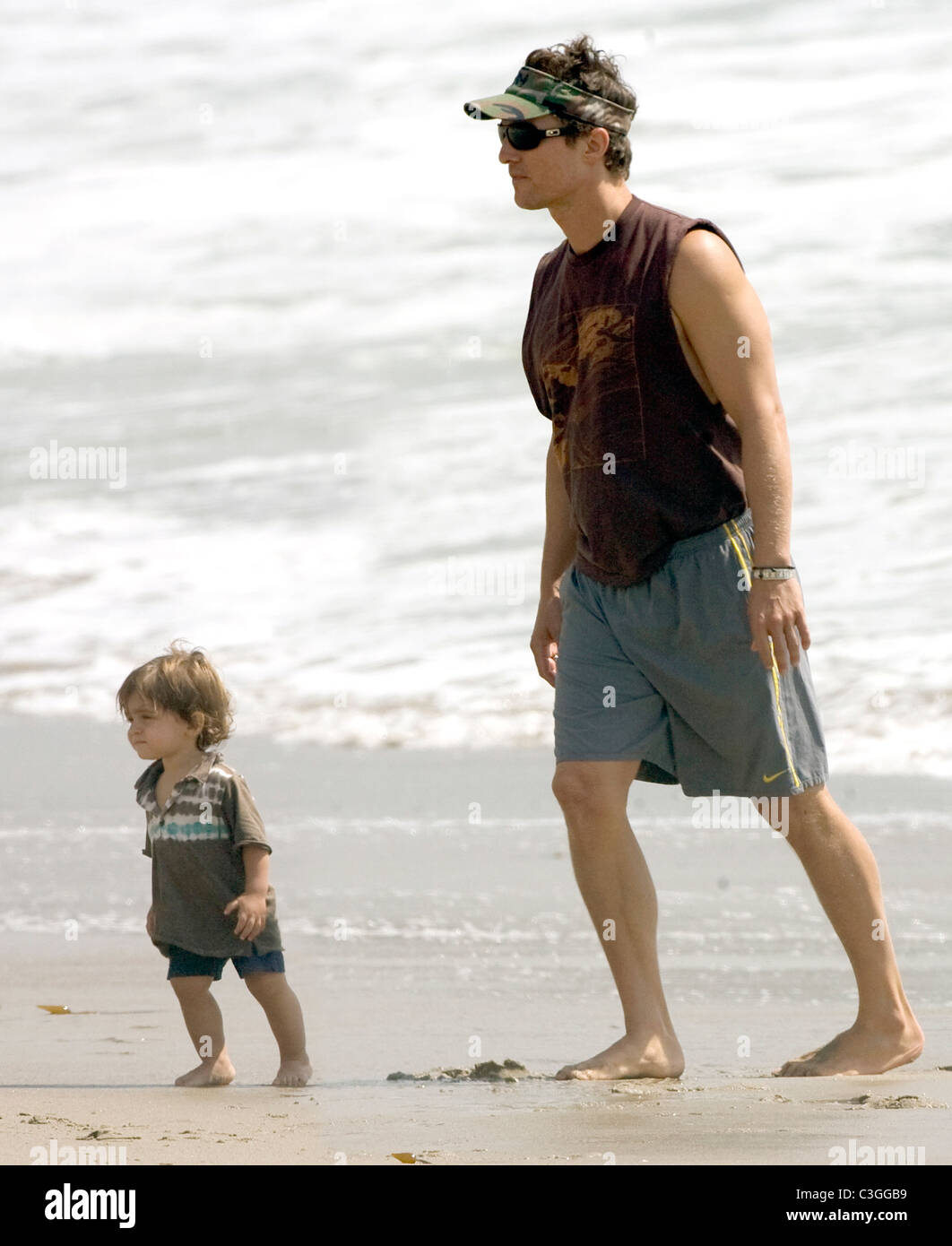 Matthew McConaughey plays with his son, Levi, on a beach in Malibu Los ...