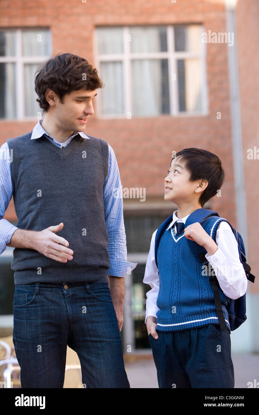 Two boys talking uniform hi-res stock photography and images - Alamy