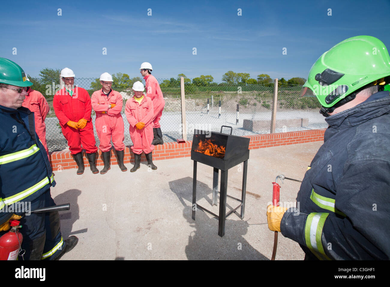 Workers in the offshore industry practice fire fighting as part of an ...