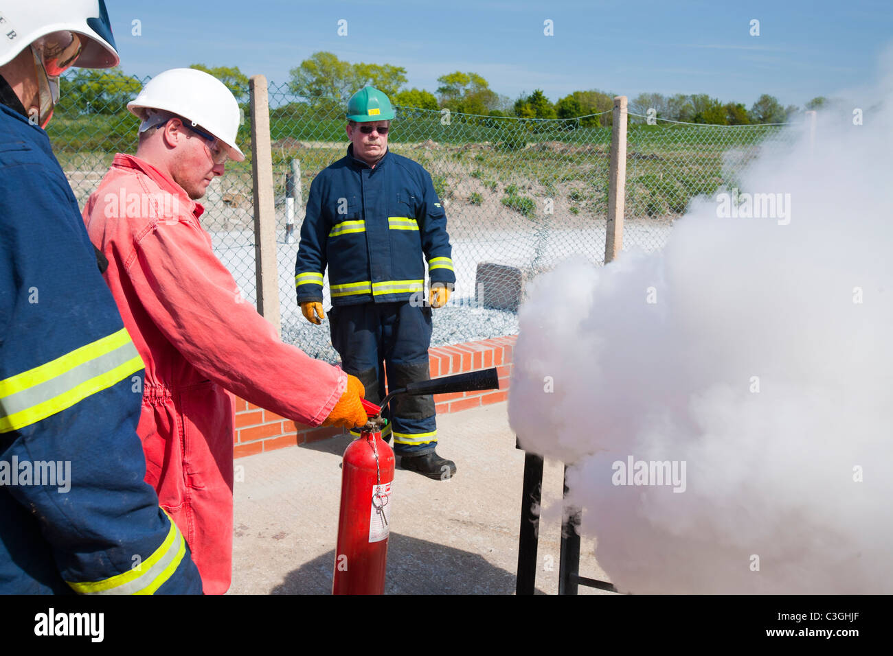 Workers in the offshore industry practice fire fighting as part of an ...