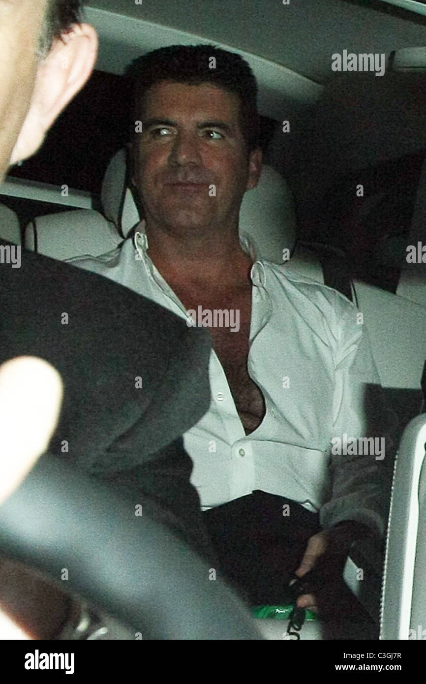 Simon Cowell arriving late for the start of his 50th birthday party in ...