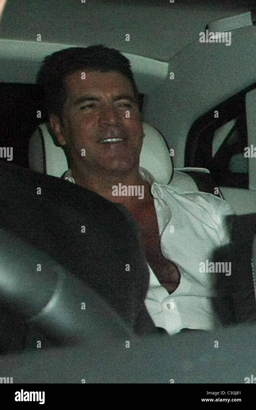 Simon Cowell arriving late for the start of his 50th birthday party in ...