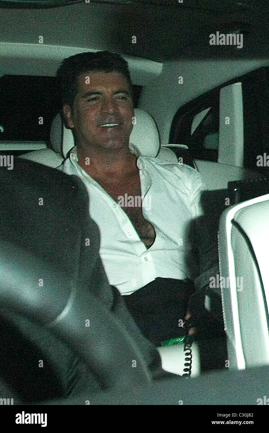 Simon Cowell arriving late for the start of his 50th birthday party in ...