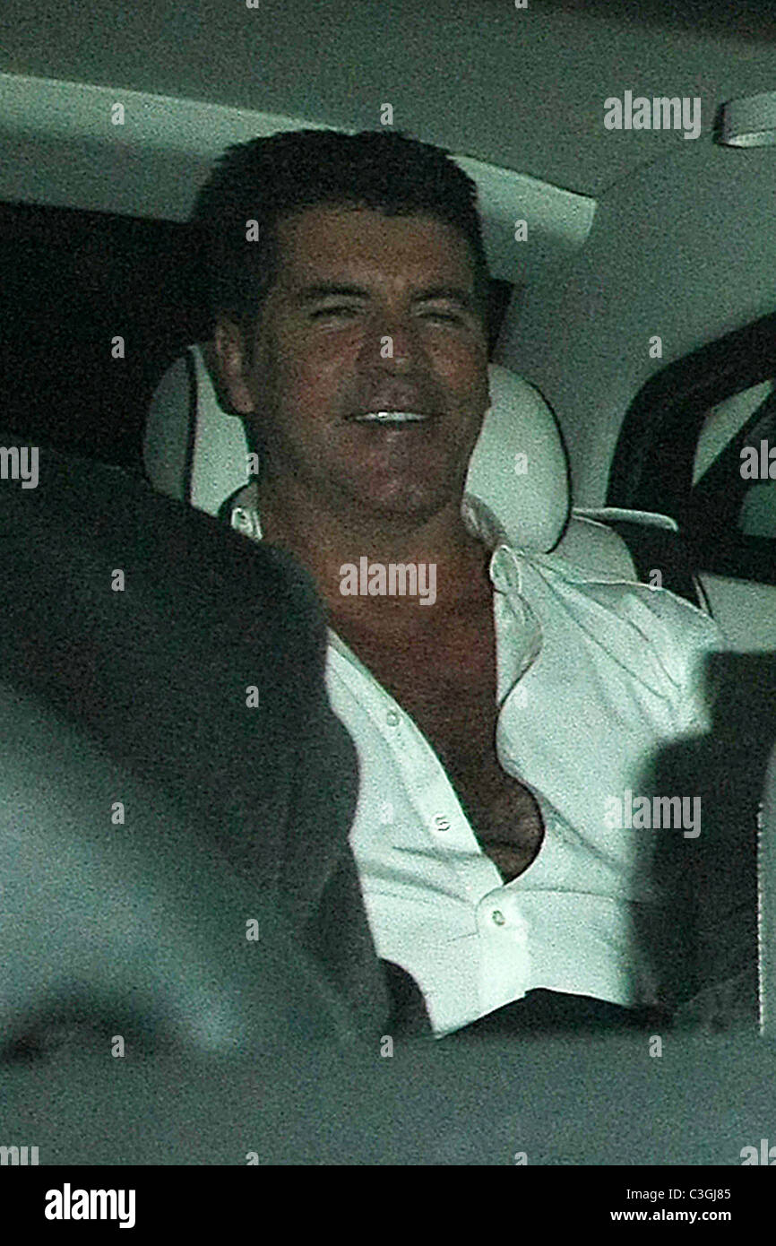 Simon Cowell arriving late for the start of his 50th birthday party in ...