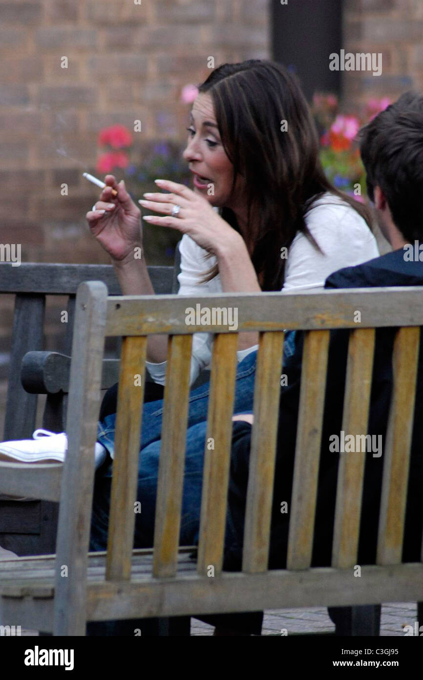 Amanda Donohoe seen smoking and chatting to a friend during a break ...