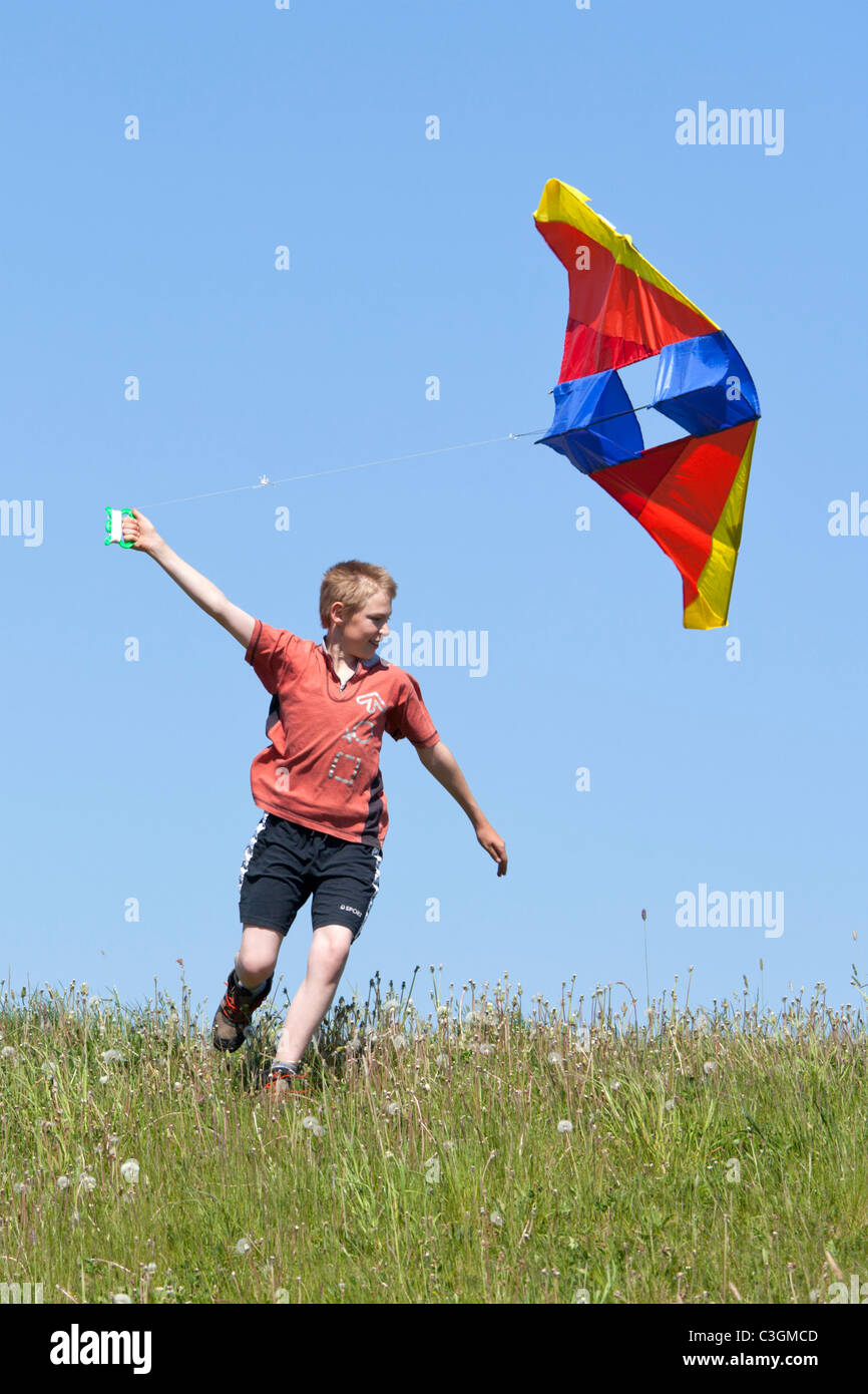 young boy flying a kite Stock Photo - Alamy