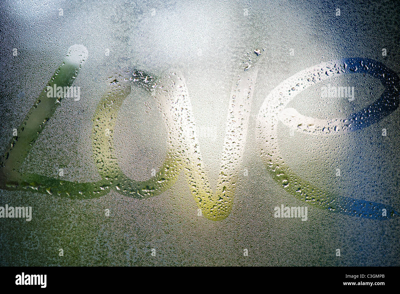 Love written in condensation on a glass window pane Stock Photo - Alamy