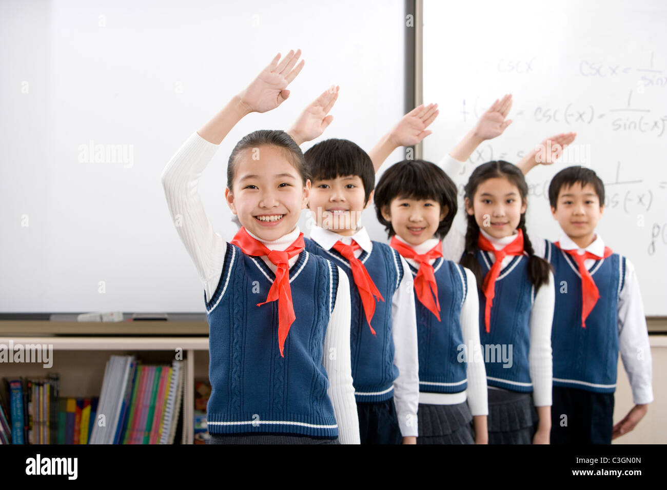 Young students saluting in a row at school Stock Photo - Alamy