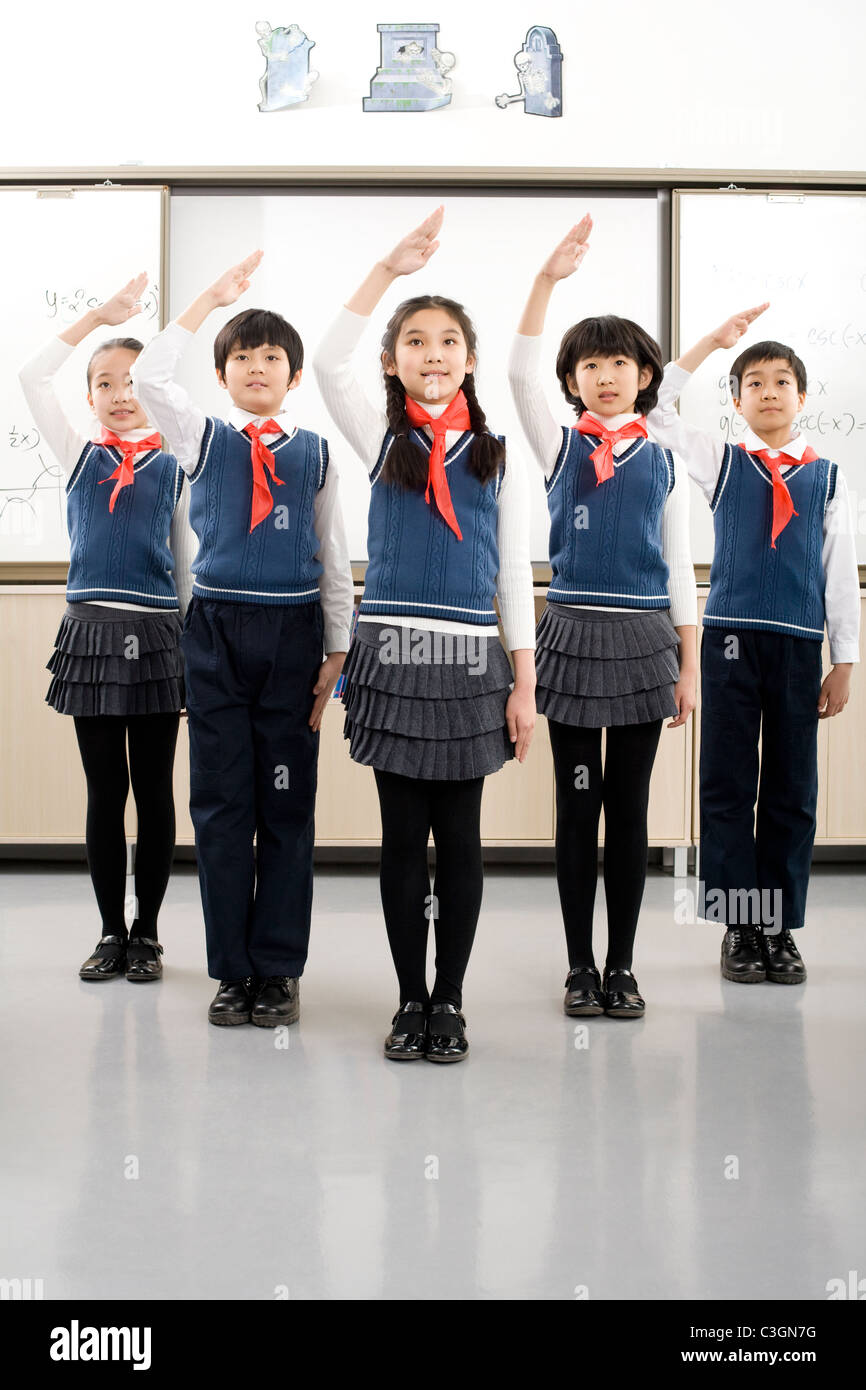 Young students saluting in a row at school Stock Photo - Alamy