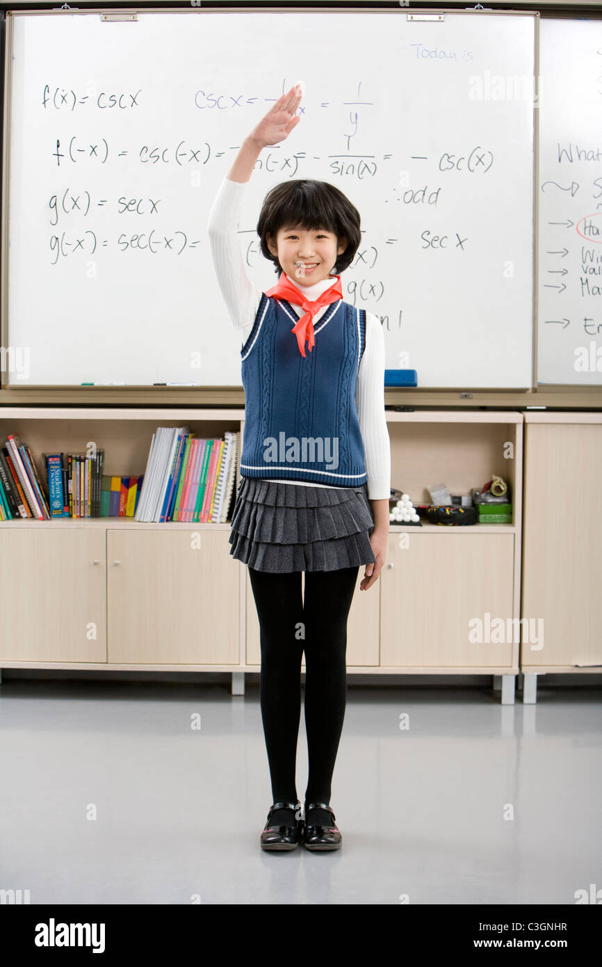 Young student saluting in front of whiteboard Stock Photo - Alamy