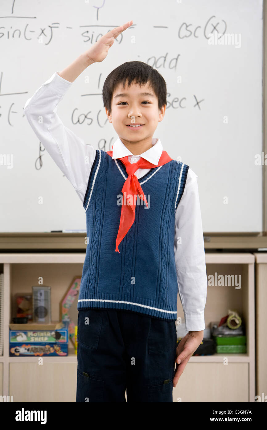 Young student saluting in front of whiteboard Stock Photo - Alamy