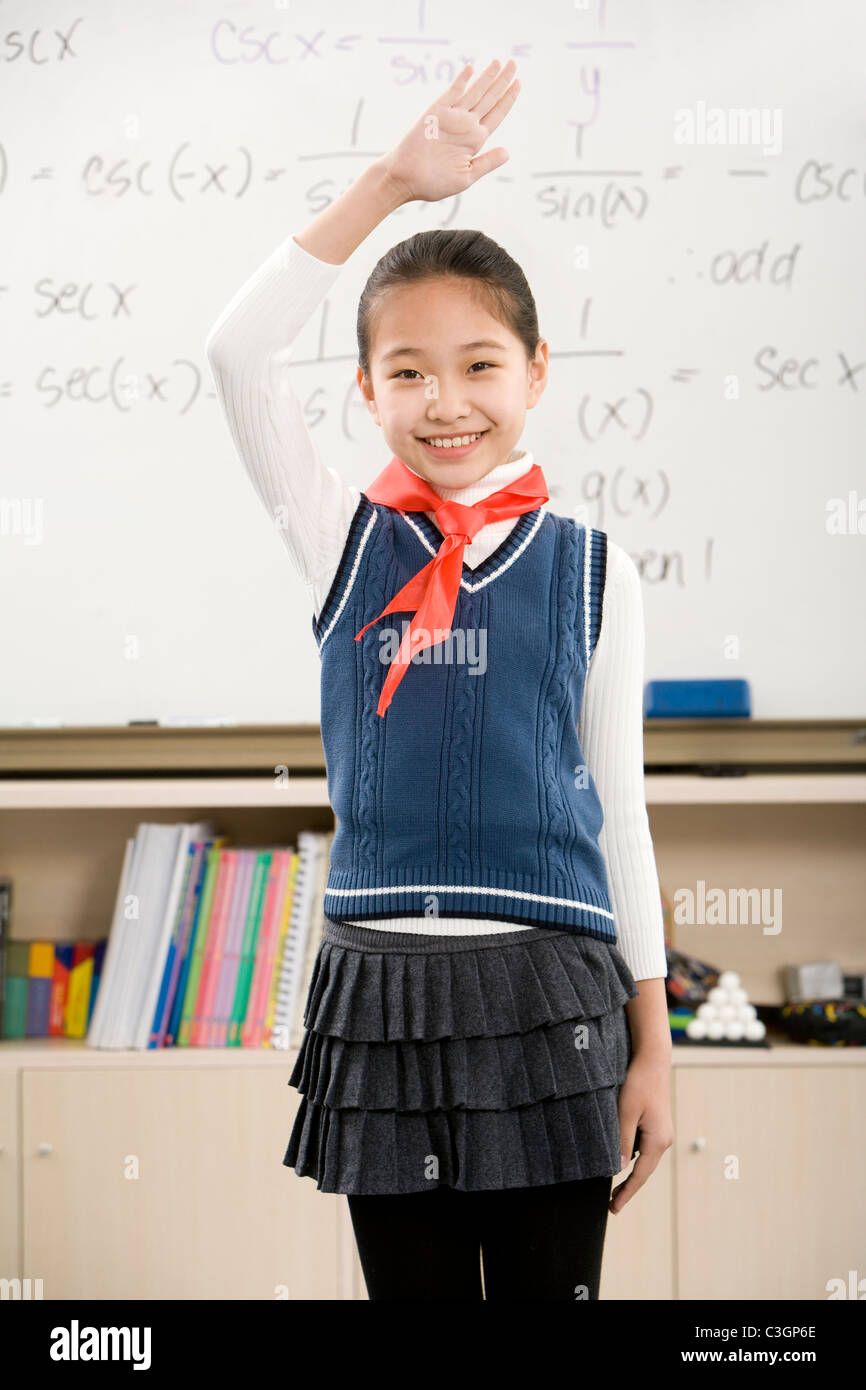 Young student saluting in front of whiteboard Stock Photo - Alamy