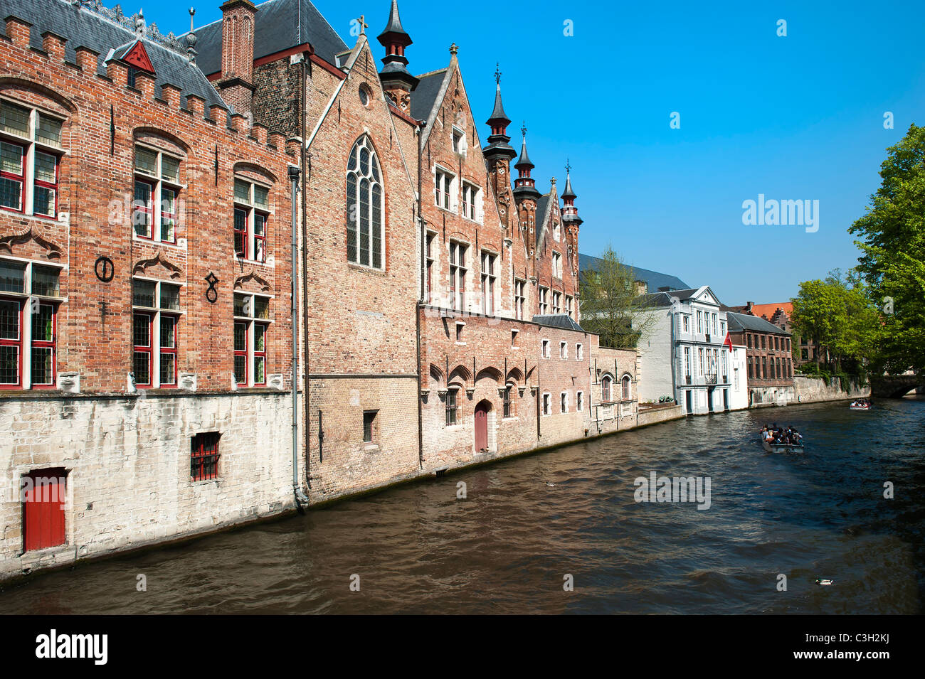 Buildings along a canal, Historic centre of Bruges, Belgium Stock Photo ...
