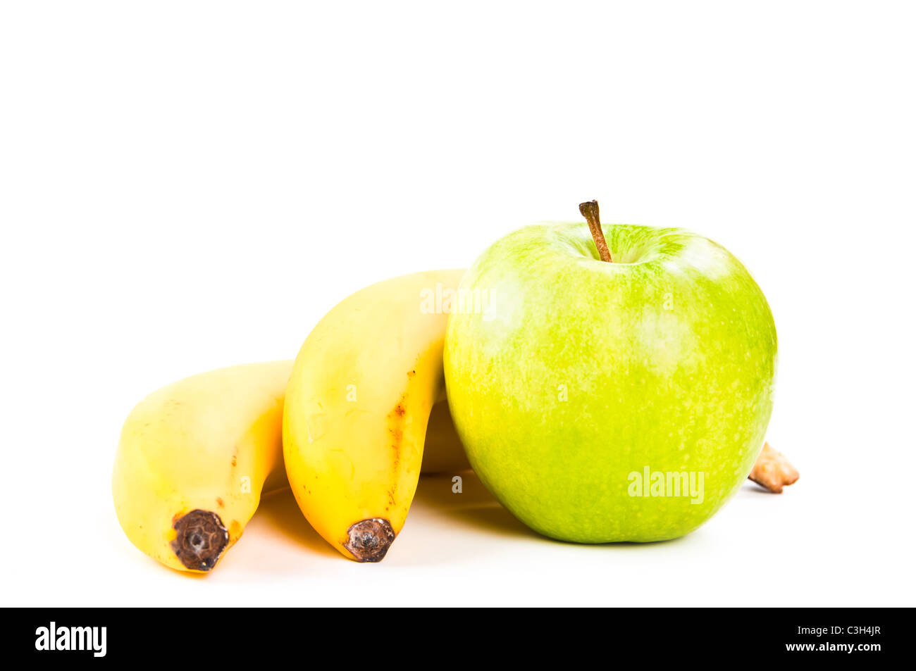 two bananas and an apple isolated on white background Stock Photo - Alamy