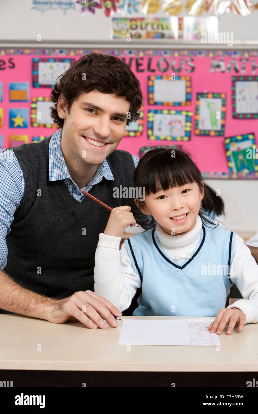 Teacher and student smiling into the camera during class Stock Photo ...