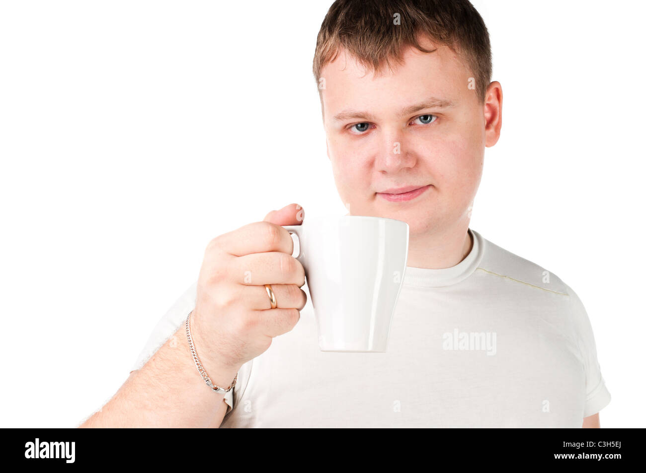 Isolated Young man drinking a cup Stock Photo - Alamy