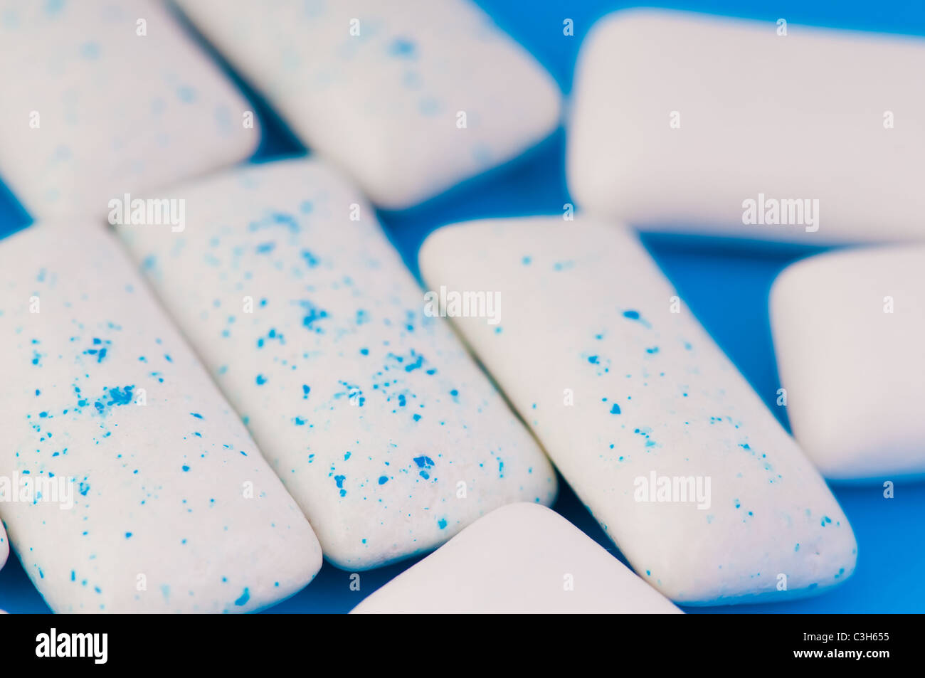 Chewing gums on blue Stock Photo - Alamy