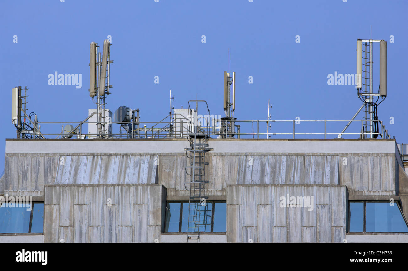 Communications masts on top of a building Stock Photo - Alamy