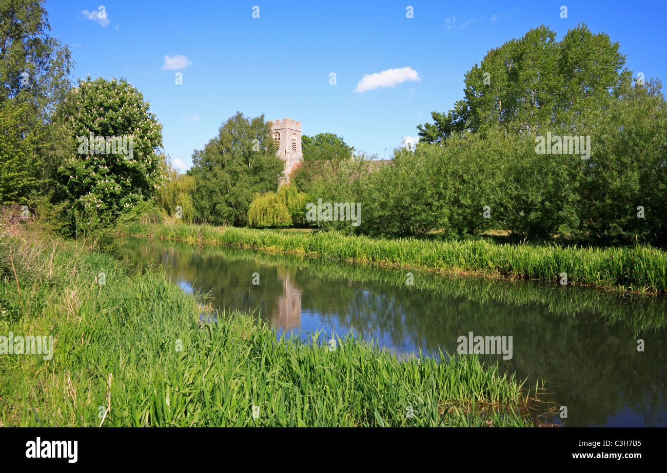 A scene in spring with an English country church and reflections by the ...