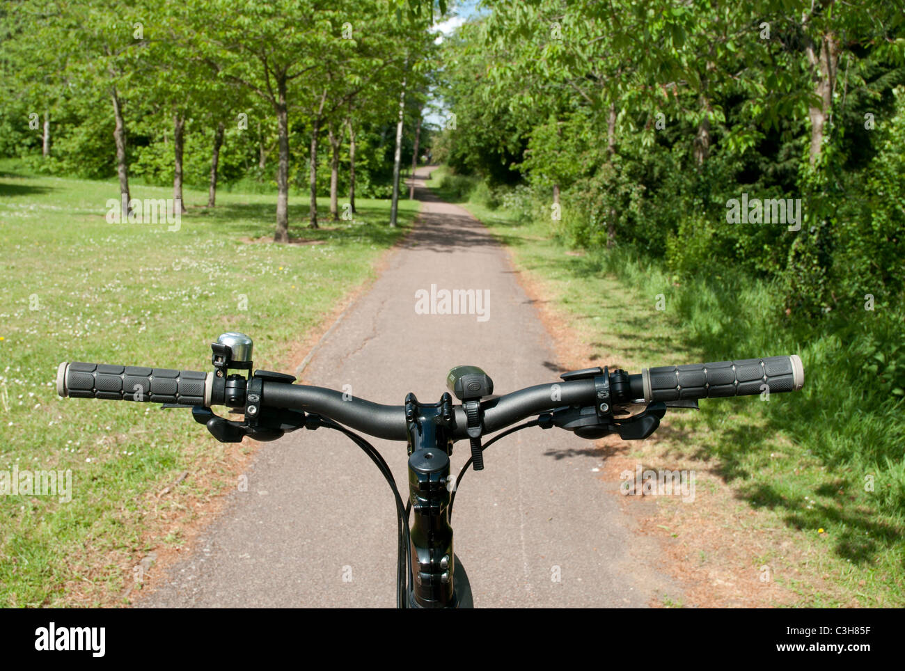 Bicycle Handlebars and Cycle Path Stock Photo - Alamy