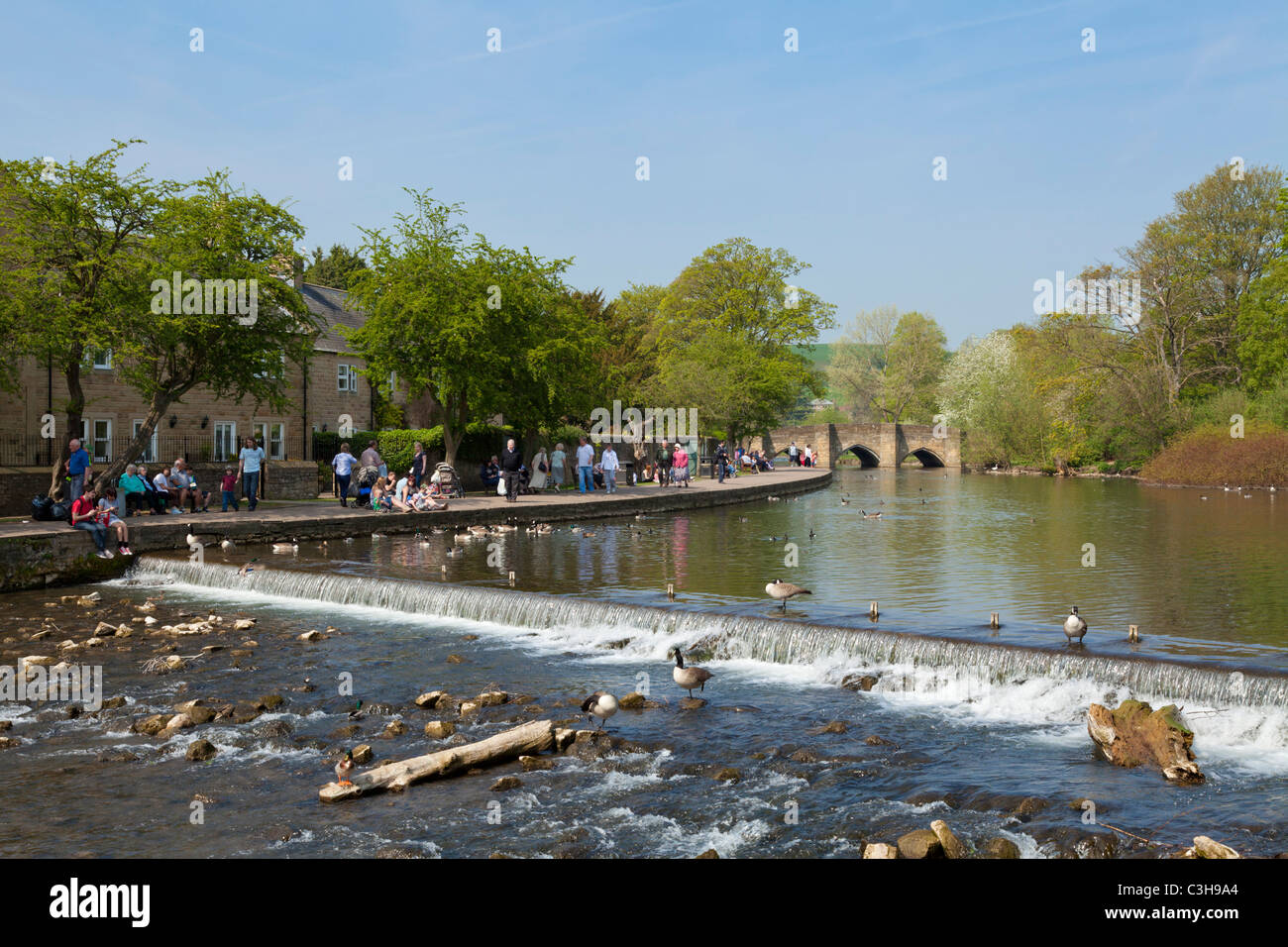 small weir on the River Wye flowing through Bakewell Derbyshire Peak ...