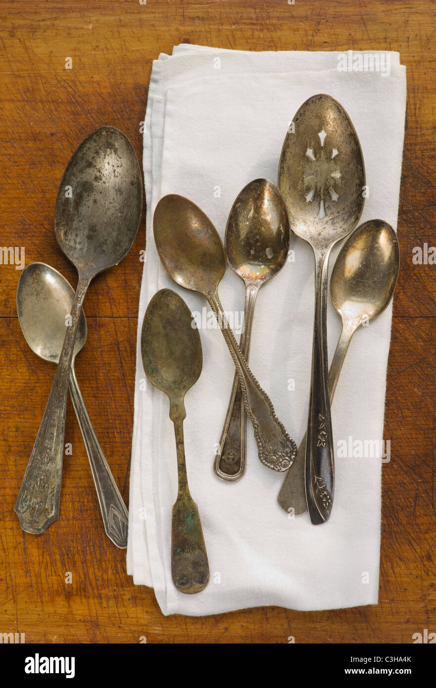 Close up of rusty silver spoons and napkin Stock Photo - Alamy