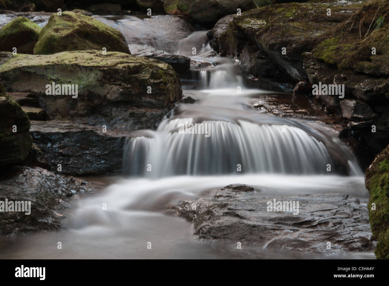 landscape image of fast flowing river with rocks Stock Photo - Alamy