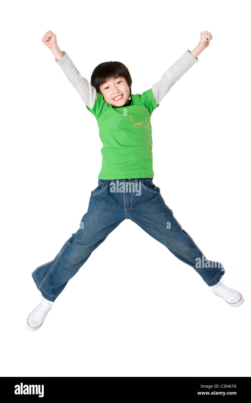 Young boy jumping up with excitement Stock Photo - Alamy