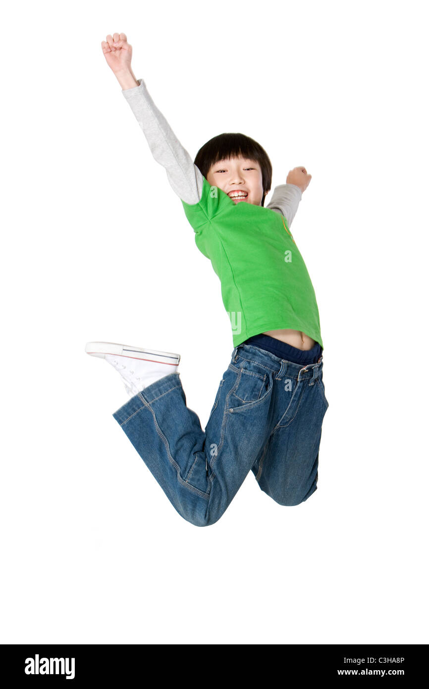 Young boy jumping up with excitement Stock Photo - Alamy