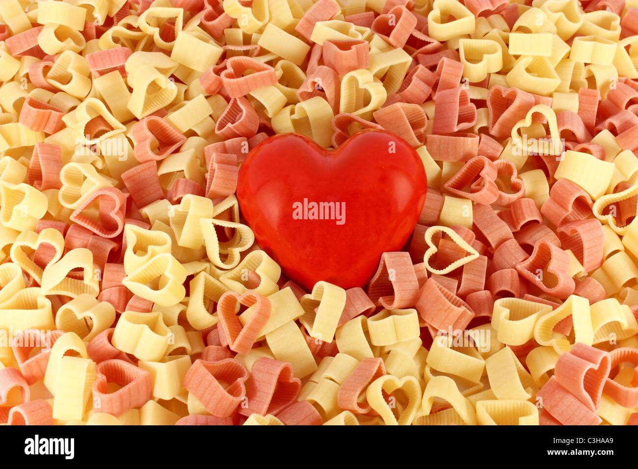 Colored pasta in form of heart with big red heart Stock Photo - Alamy