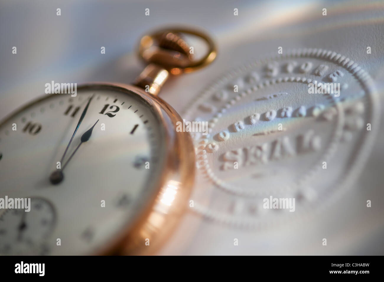 Close up of pocket watch and corporate seal Stock Photo - Alamy