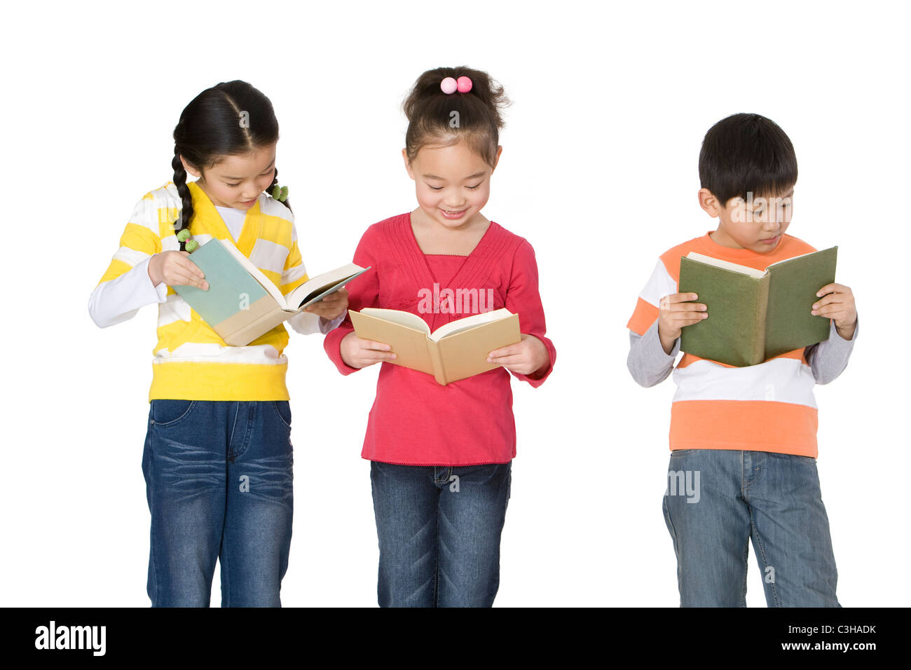 Three classmates reading together side by side Stock Photo - Alamy