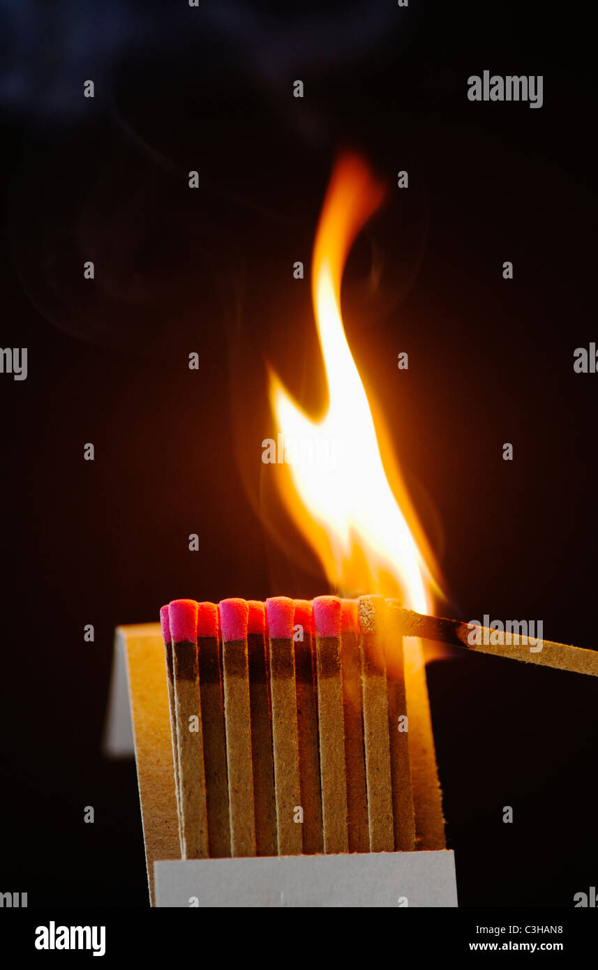Close up of matches with one burning Stock Photo - Alamy